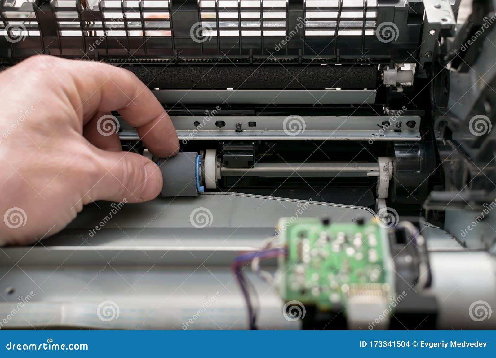 The Master Hand Changes the Rubber Grip Roller in the Printer Stock ...