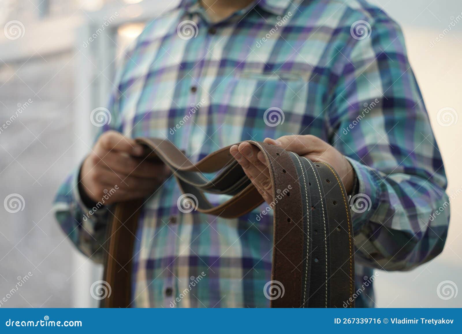The Master Holds Handmade Leather Belts with Buckles in His Hands Stock ...