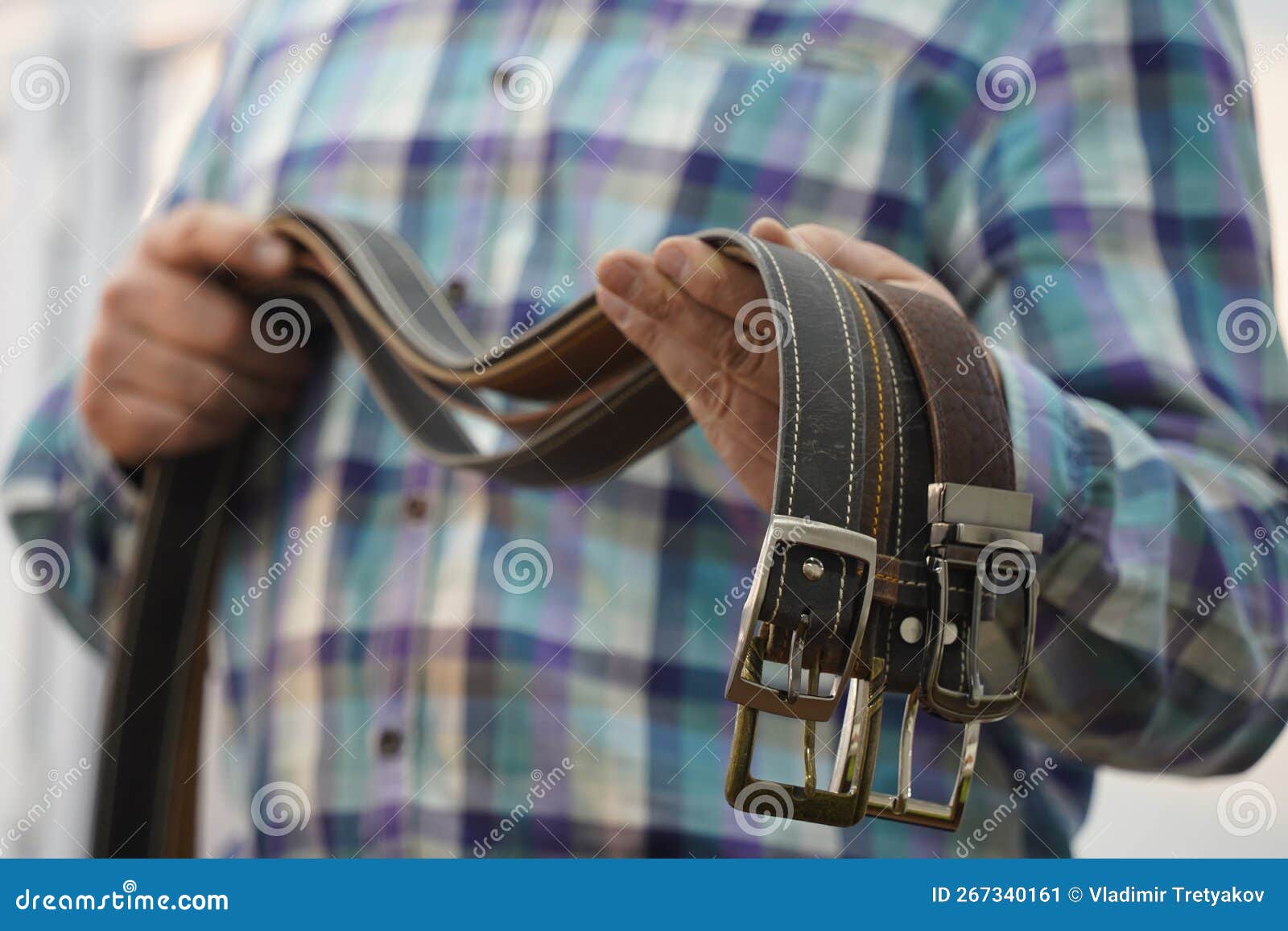 The Master Holds Handmade Leather Belts with Buckles in His Hands Stock ...