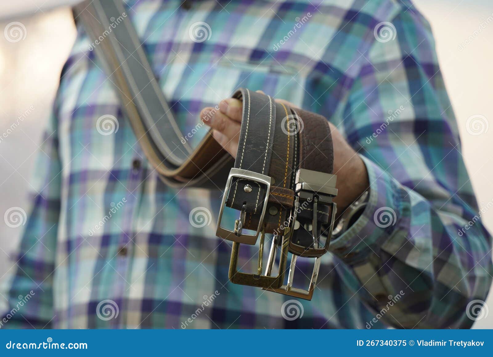 The Master Holds Handmade Leather Belts with Buckles in His Hands Stock ...