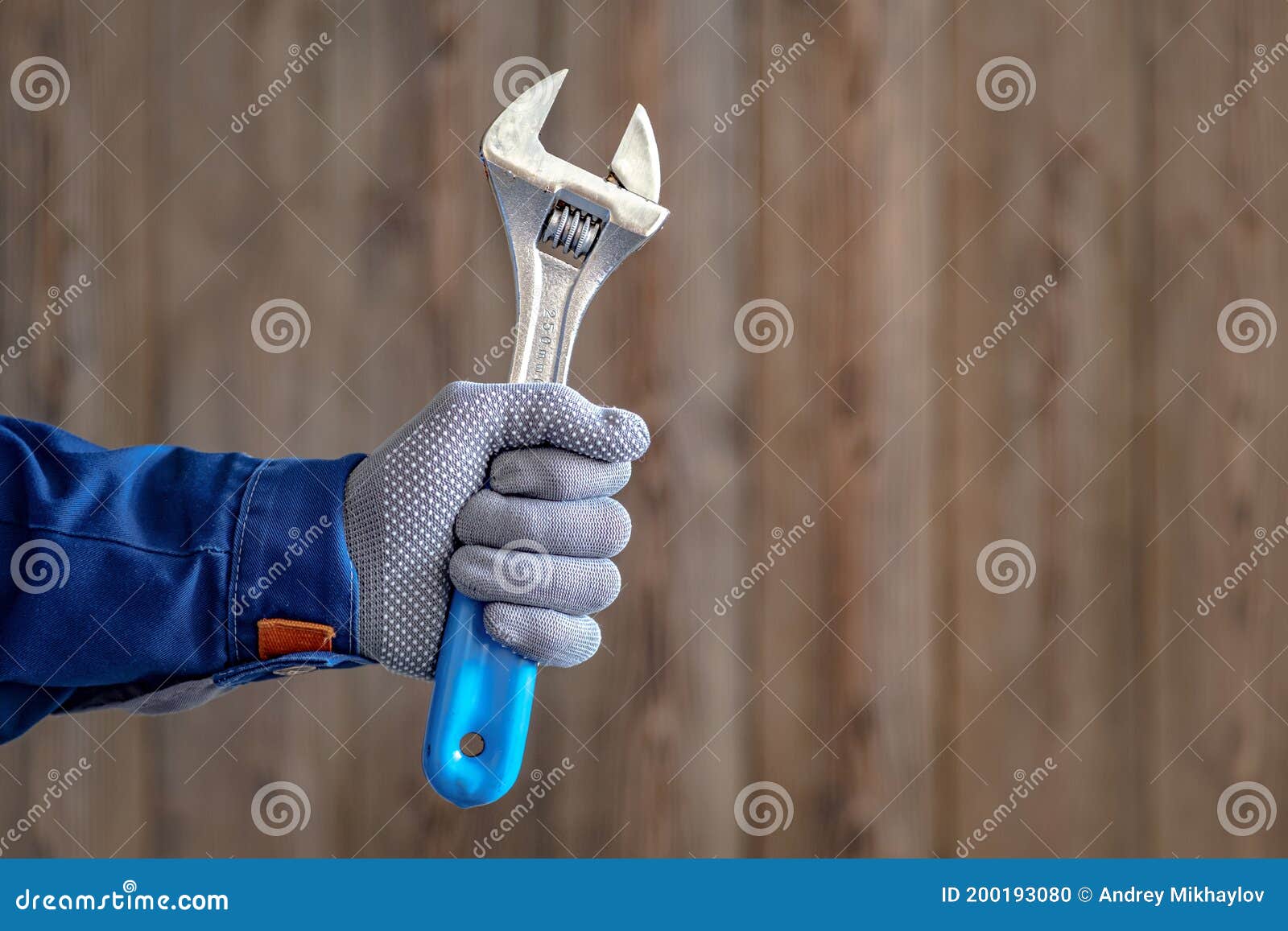The Master Holds in His Hand an Adjustable Locksmith Key with a Blue ...