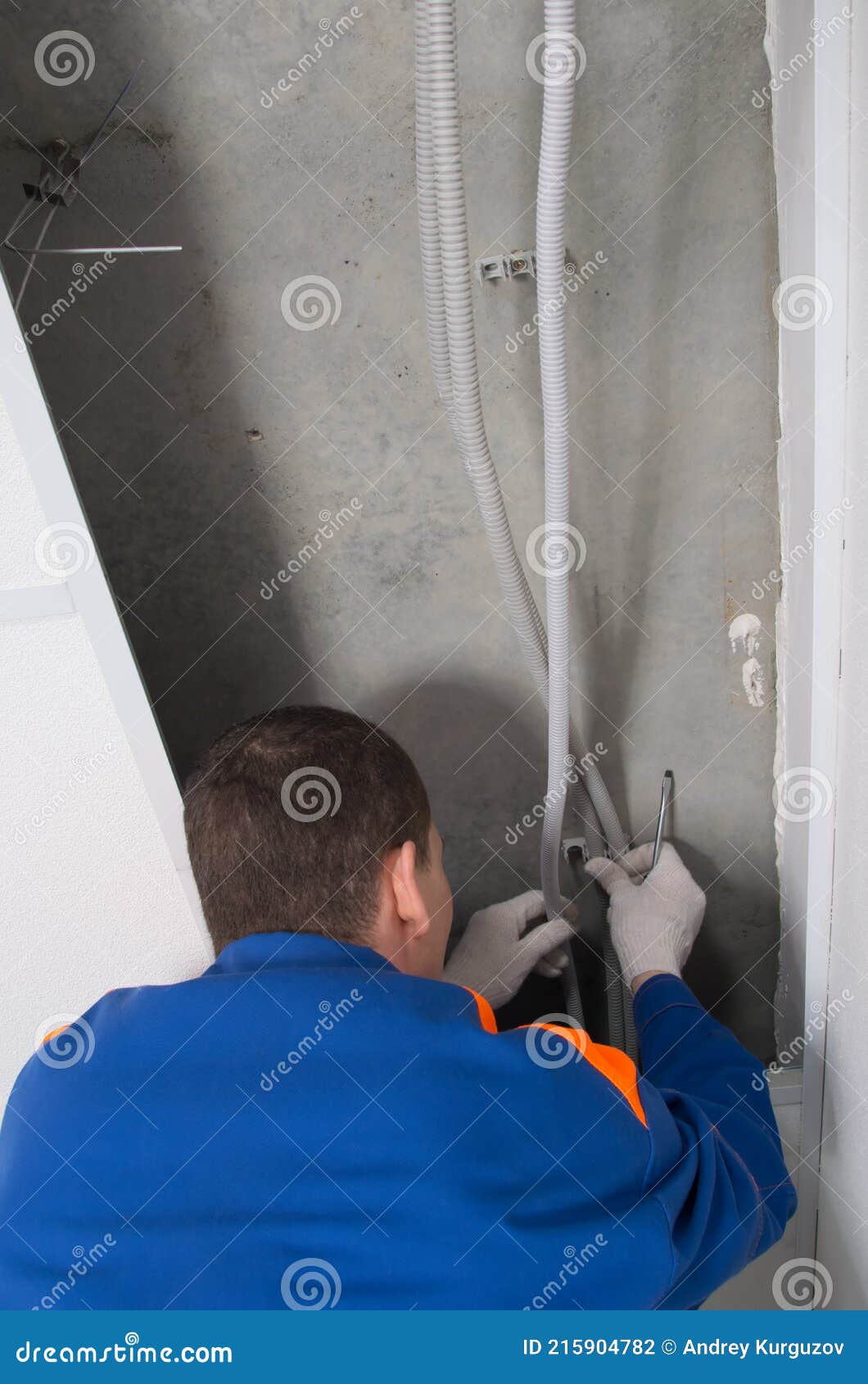 The Master of Installation of Hidden Wiring, Installs the Cable in ...