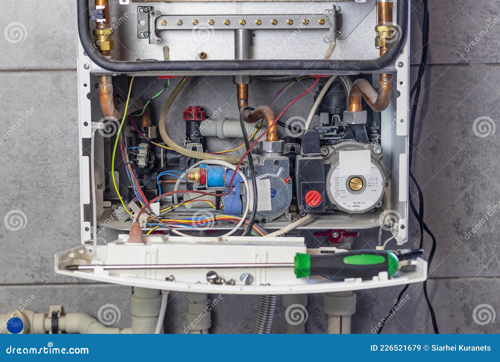 The Master Installs a Gas Boiler that Hangs on the Wall. the Front ...