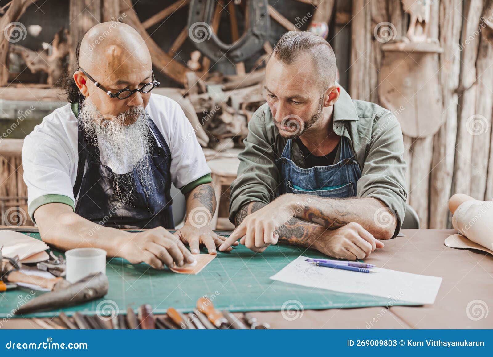Master of Leather Tailor Teaching and Training Young Man for Making ...