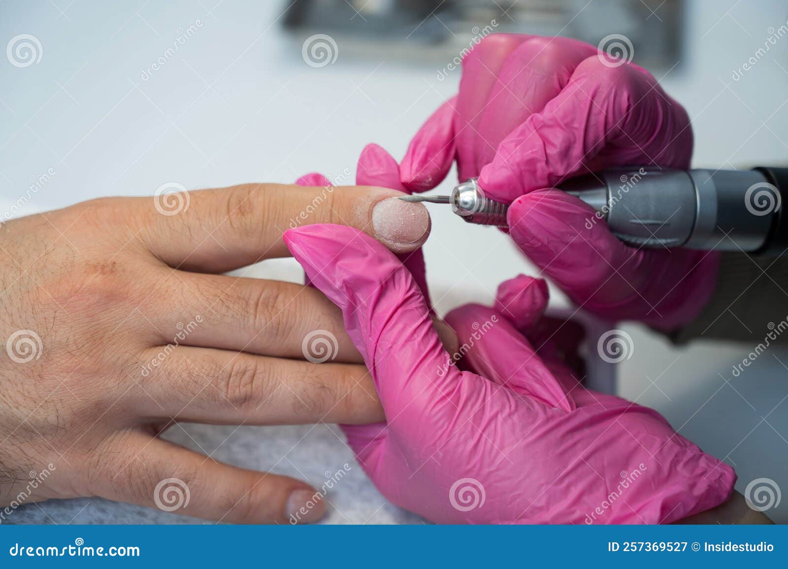 The Master Makes a Hardware Manicure To a Male Client. Stock Image ...