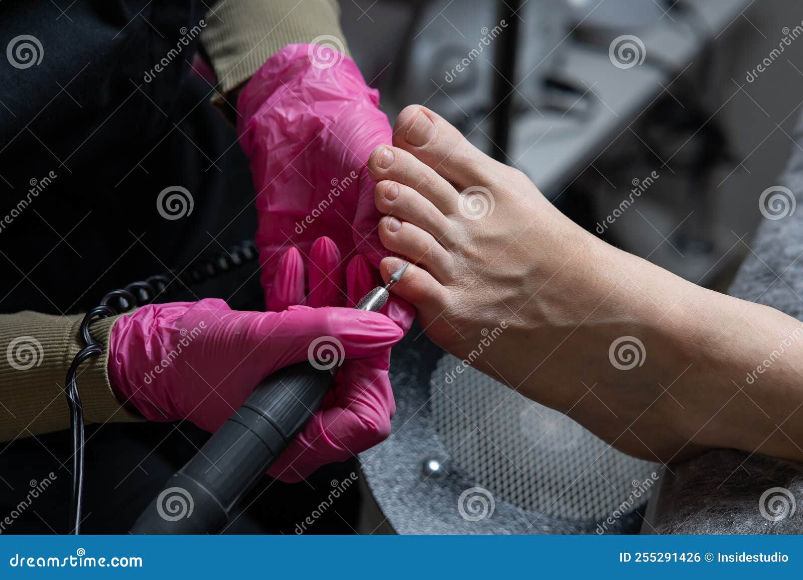 The Master Makes Hardware Pedicures To the Client. Cuticle Treatment ...