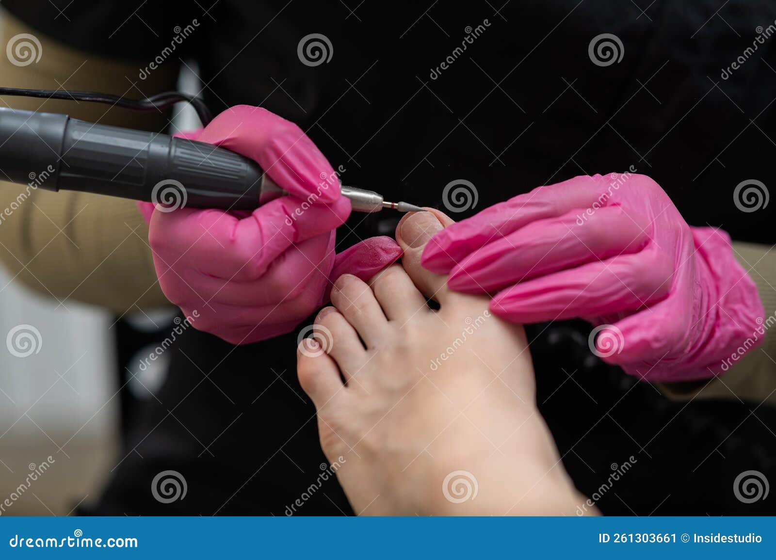 The Master Makes Hardware Pedicures To the Client. Cuticle Treatment ...