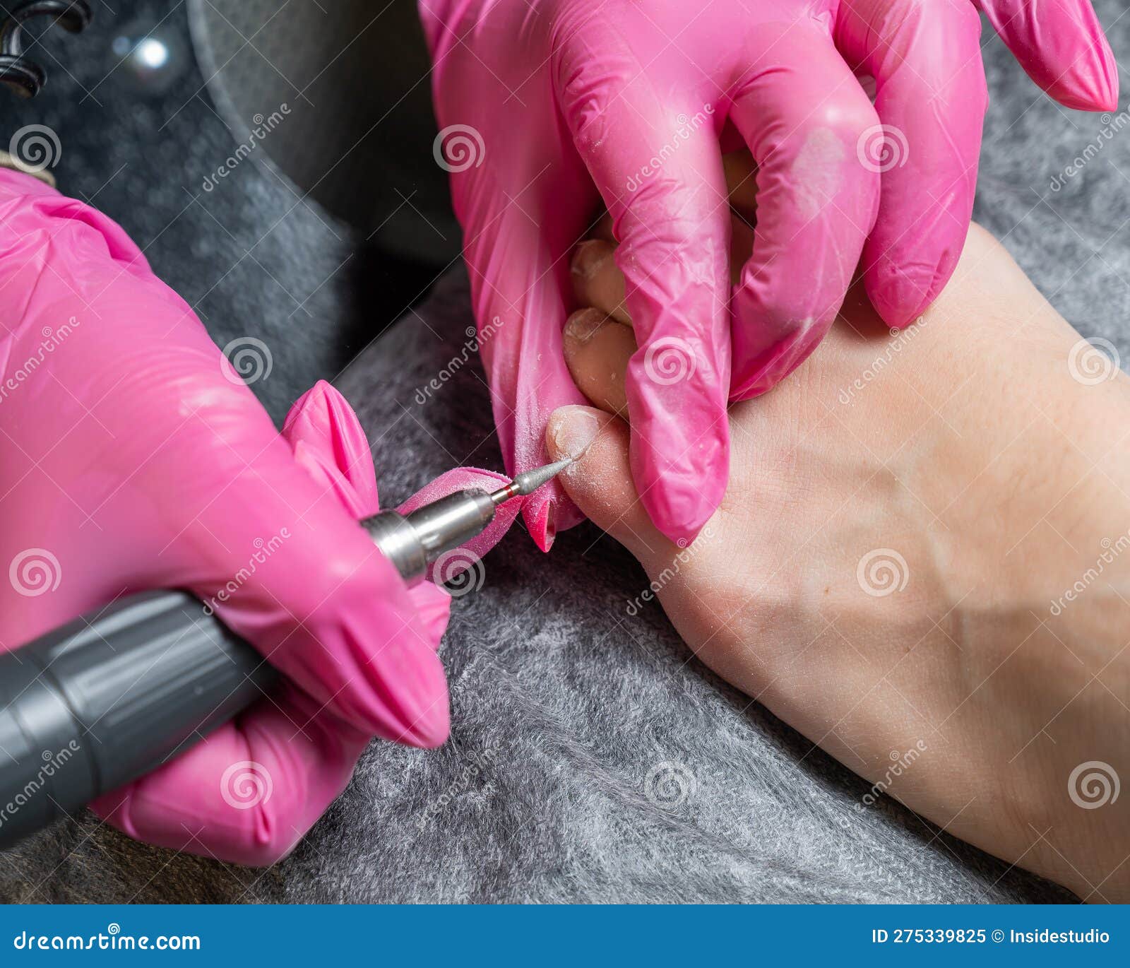 The Master Makes Hardware Pedicures To the Client. Cuticle Treatment ...