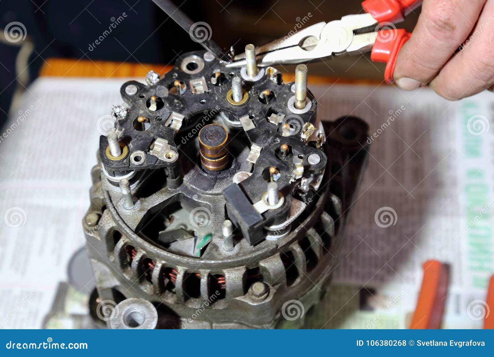 The Master Man Repairs the Old Car Generator at Home. Stock Photo ...