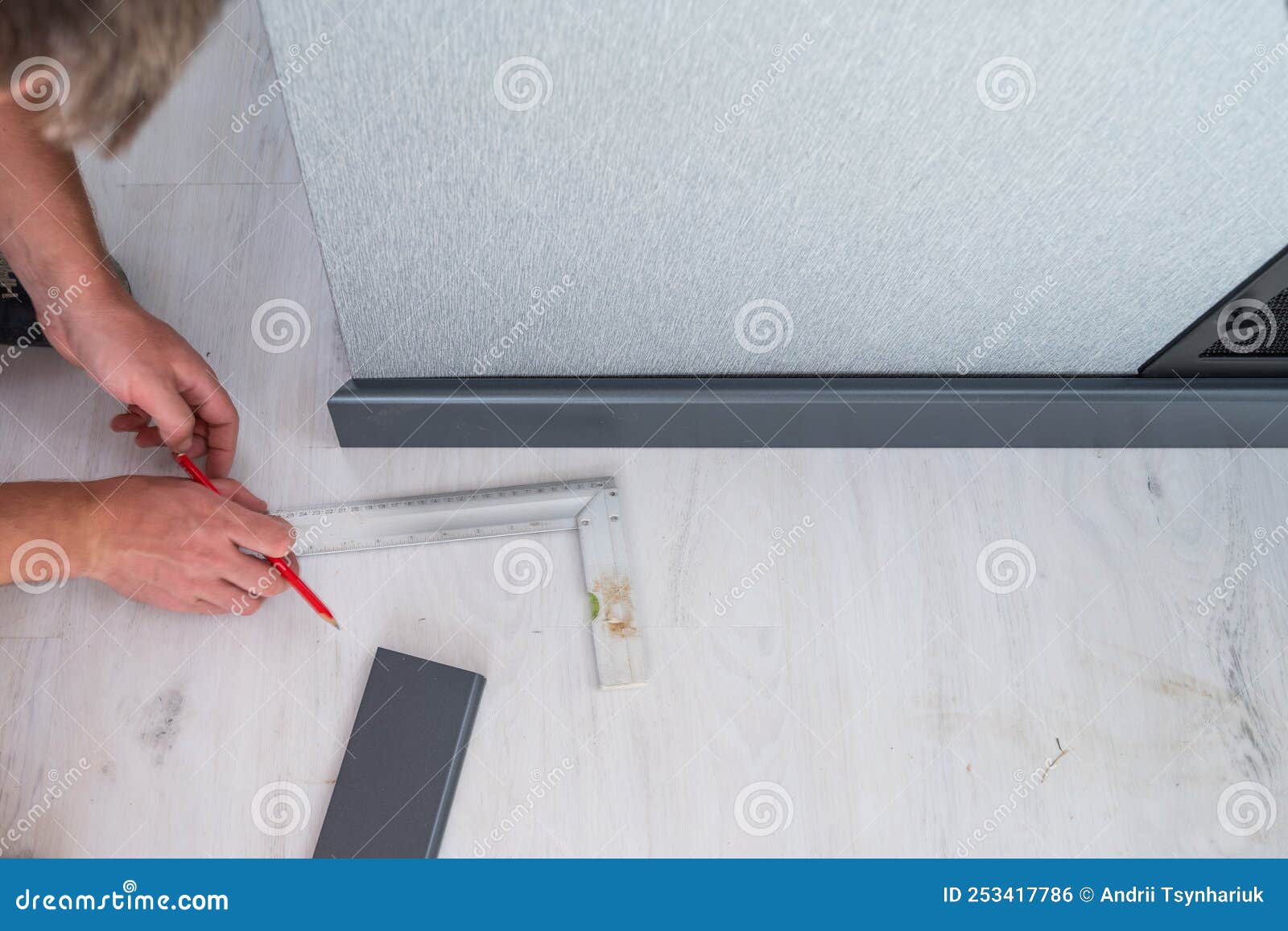 The Master Measures the Length of the Plinth for Cutting, Installing ...