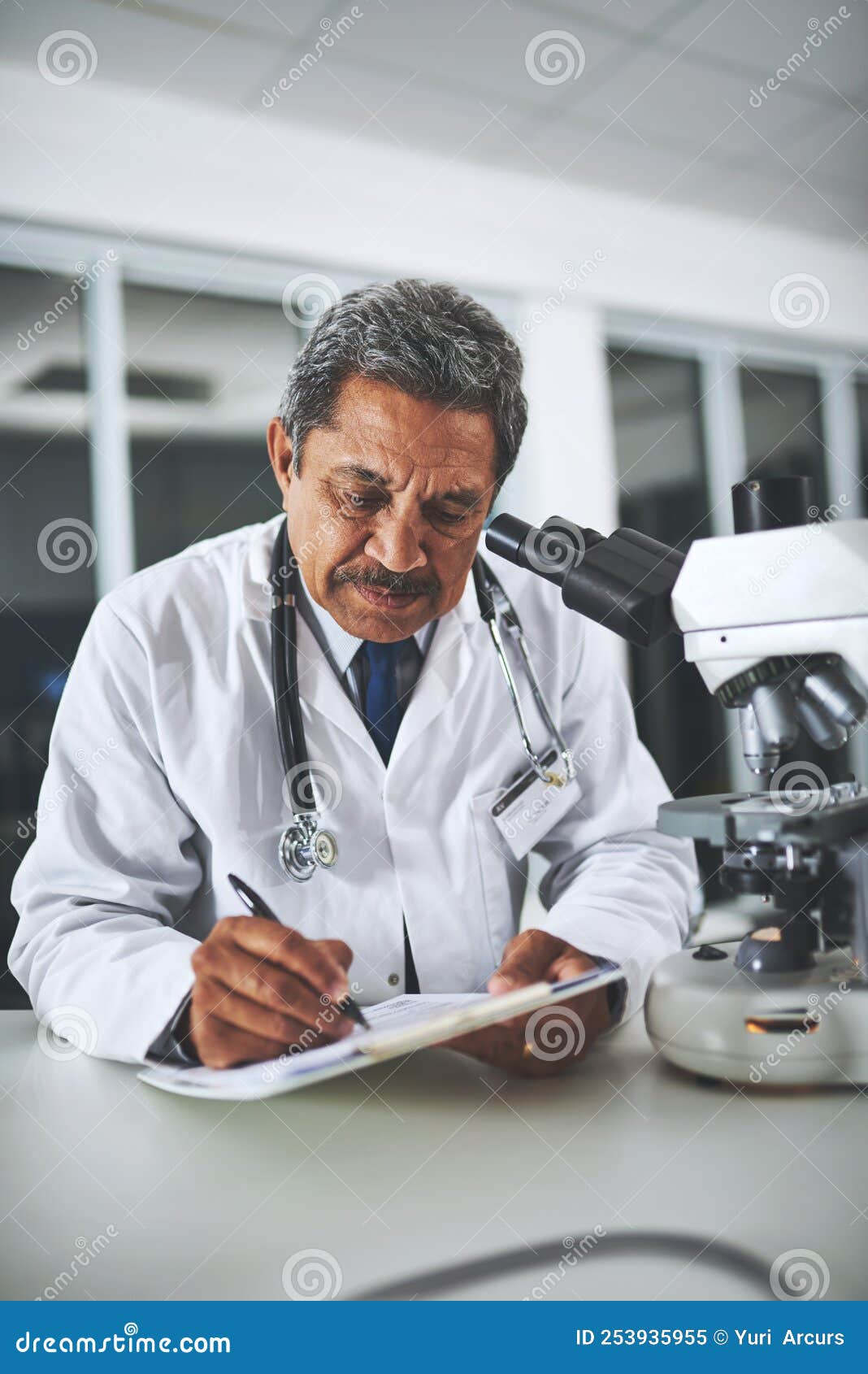 The Master of Medical Science. a Mature Scientist Using a Microscope ...