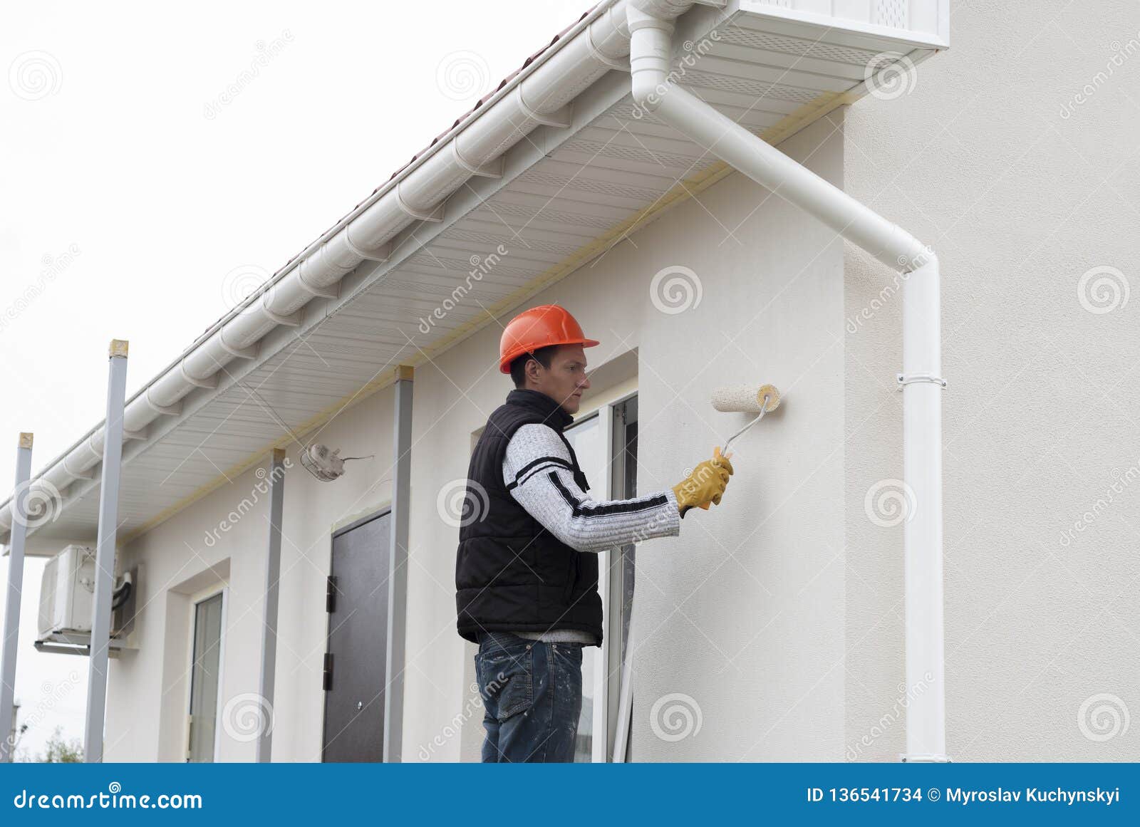 Master paints the wall stock photo. Image of painters - 136541734