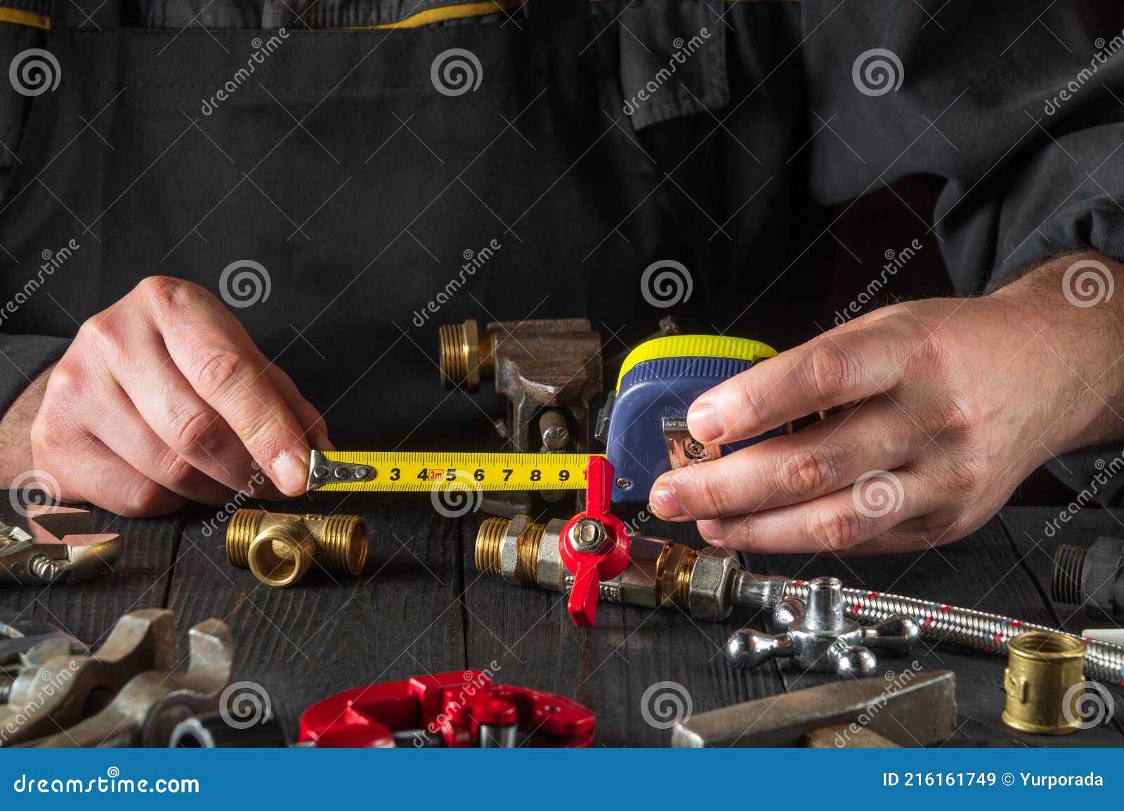 Master Plumber Measures the Distance Using a Tape Measure. Working ...