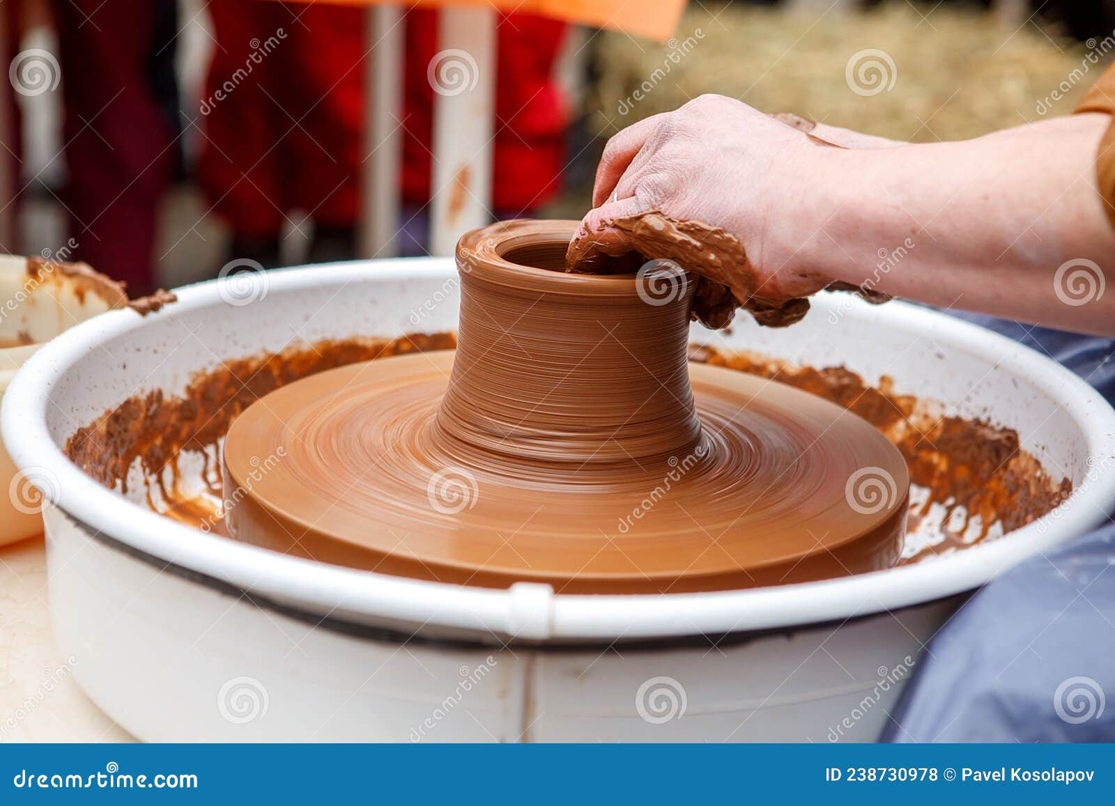The Master of Pottery Makes Dishes from Brown Clay. Folk Art Stock ...