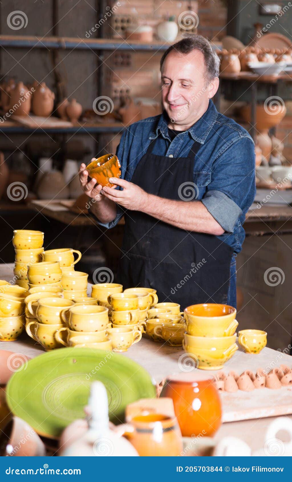 Master among the pottery stock photo. Image of kiln - 205703844
