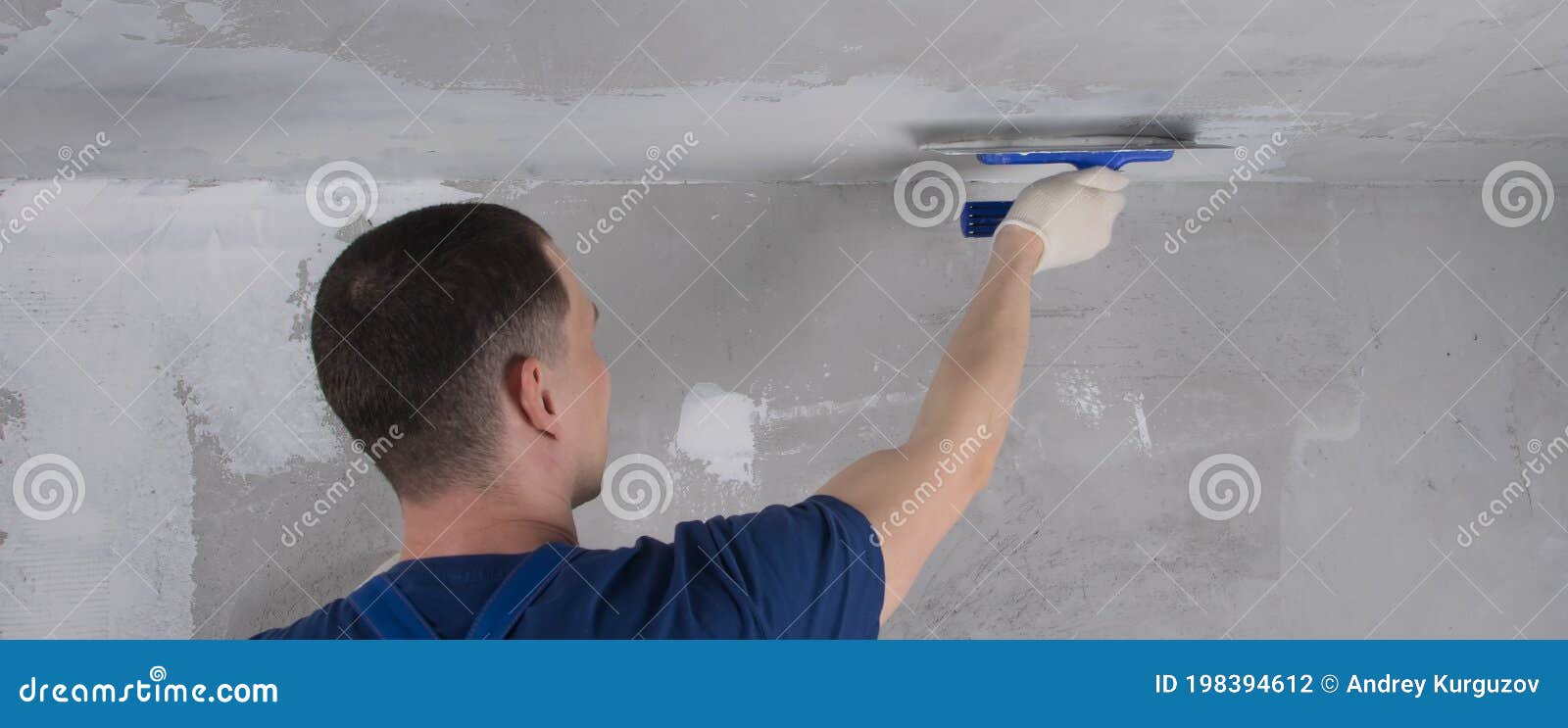 The Master Puts the Finishing Putty on the Ceiling, Close-up Stock ...