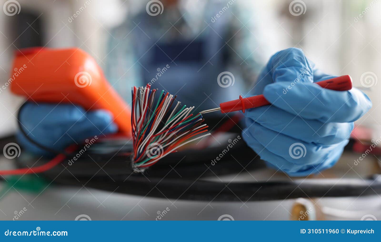 Master Repairman Testing Multicolored Wires from Cable Using Tester ...