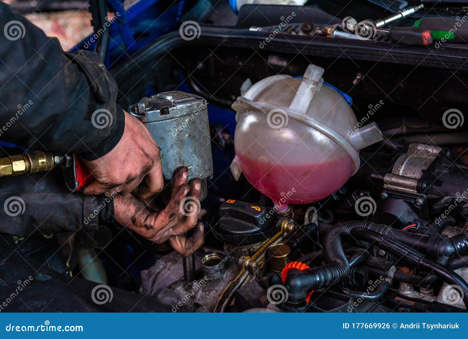 The Master Repairs the Engine in the Car Service during a Malfunction ...