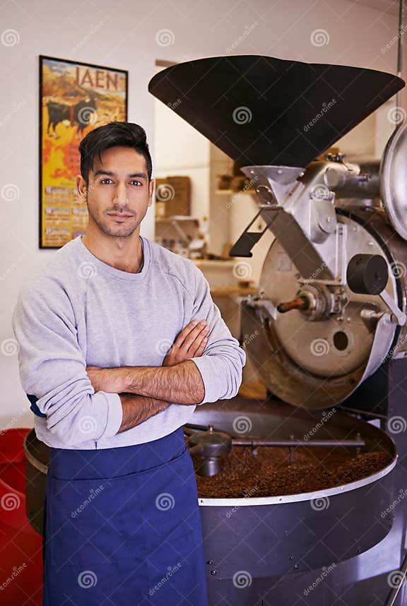 Master Roaster. a Machine Grinding and Roasting Coffee Beans. Stock ...