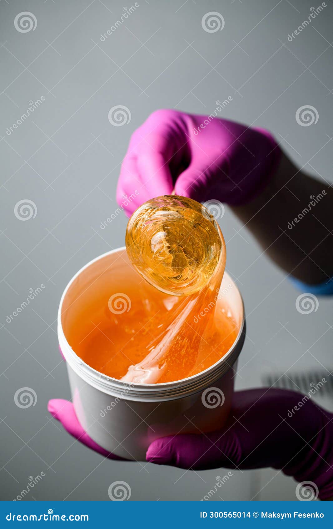 Master in a Rubber Gloves with Sugar Paste and a Spatula Stock Photo ...