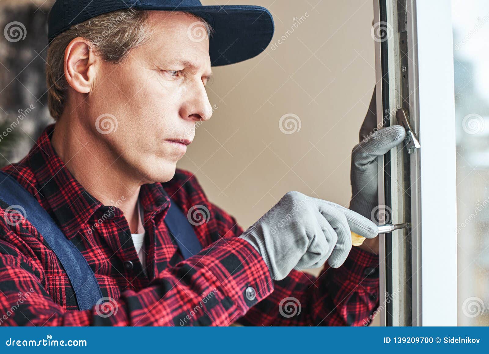 Master`s Work. Close-up of Senior Handyman Setting New Windows Stock ...