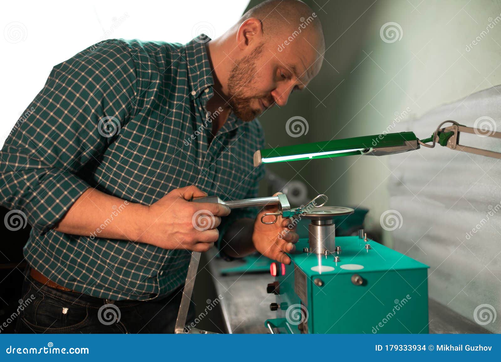 Master Sharpens Scissors on Special Equipment for Sharpening Tool Stock ...