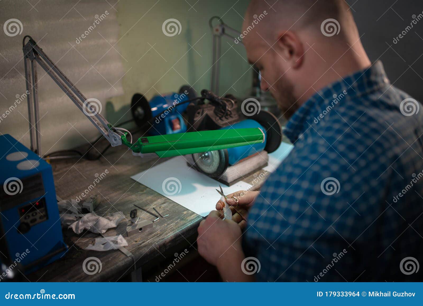 Master Sharpens Scissors on Special Equipment for Sharpening Tool Stock ...