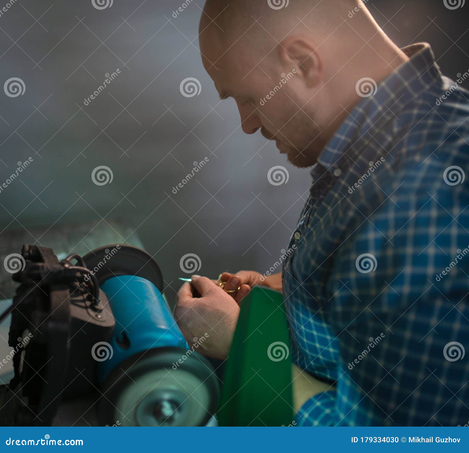 Master Sharpens Scissors on Special Equipment for Sharpening Tool Stock ...