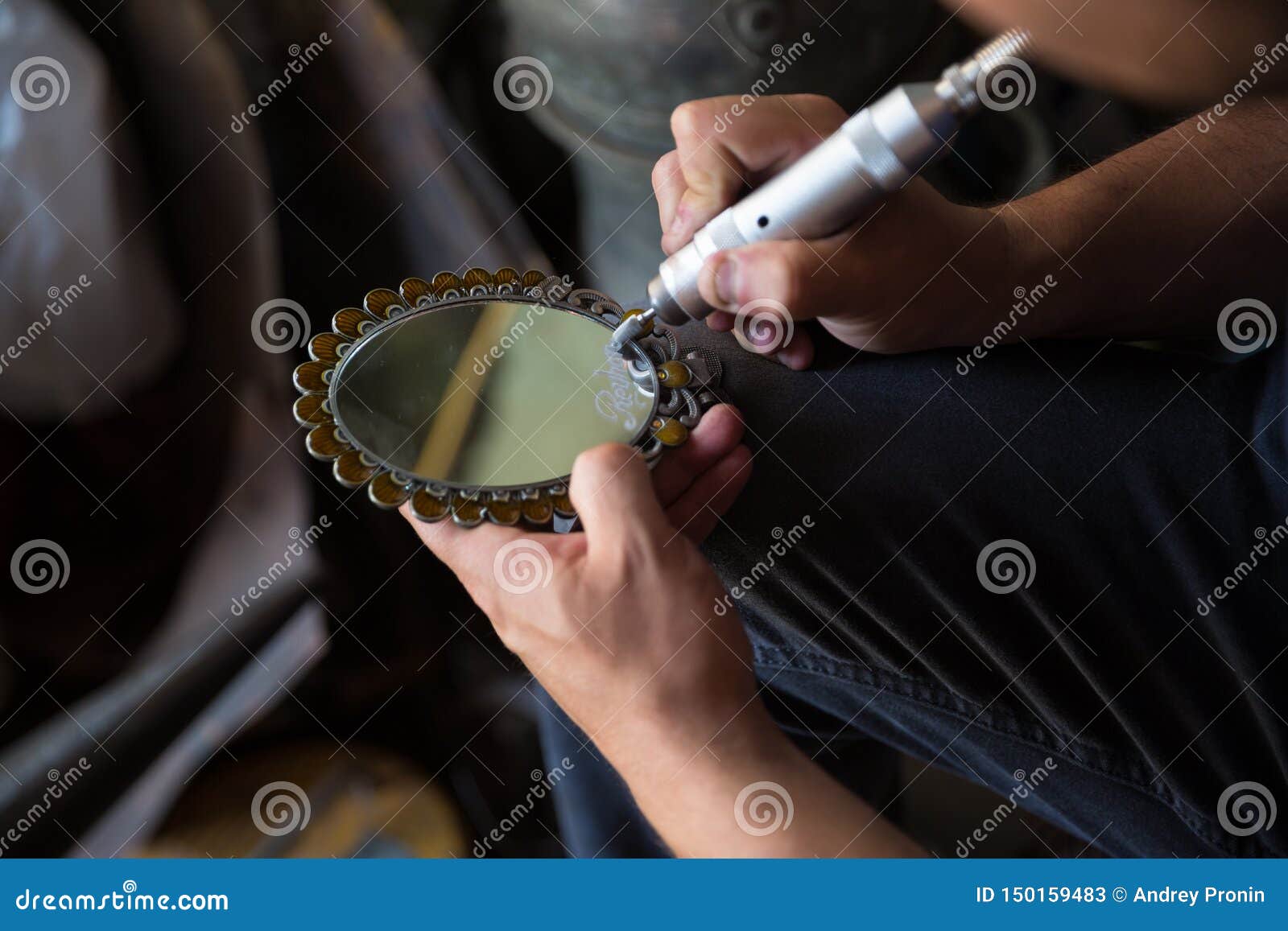 The Master the Special Tool Puts Drawing on a Mirror.Engraving on ...