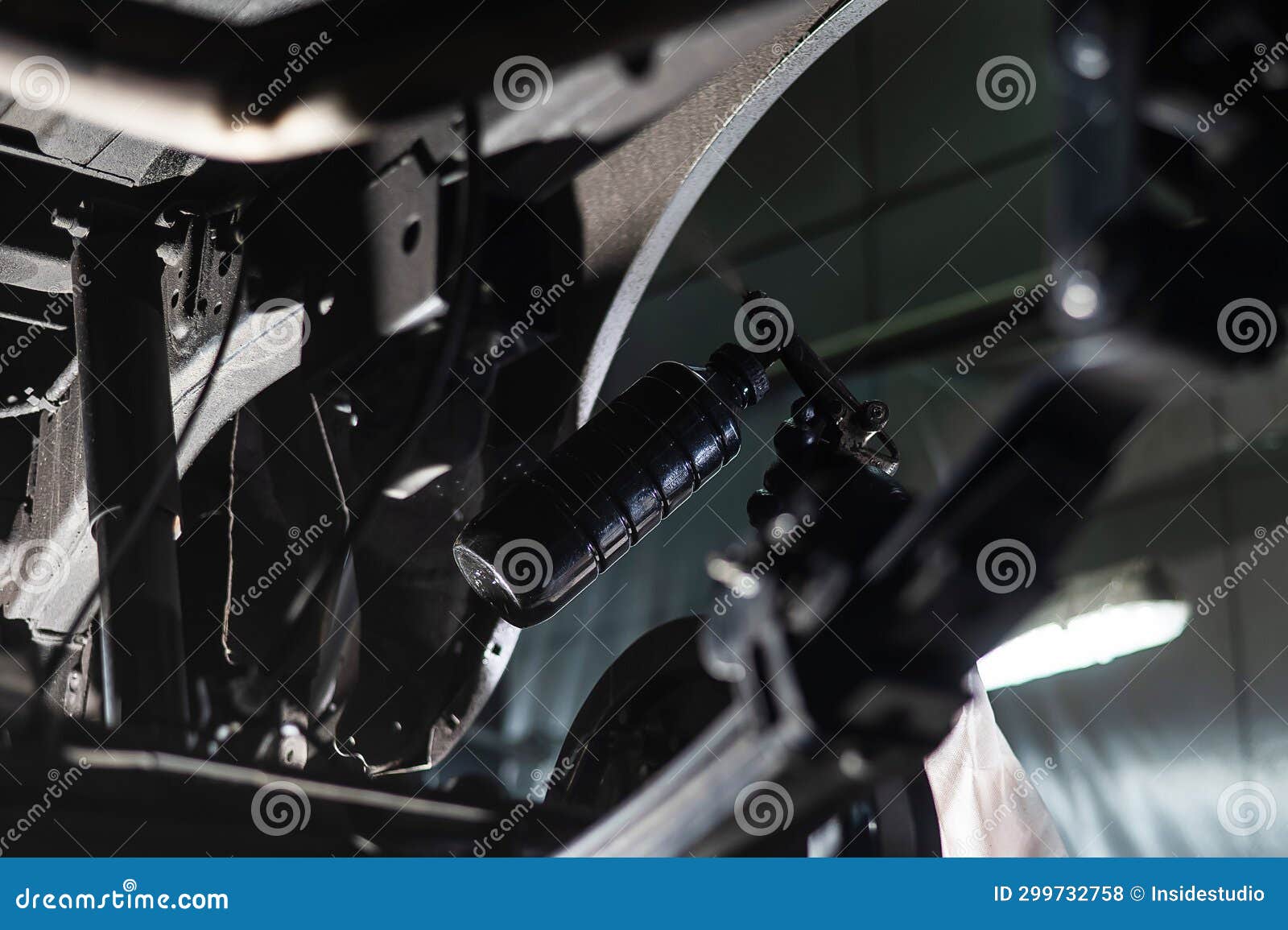 The Master Sprays an Anti-corrosion Compound on the Bottom of the Car ...