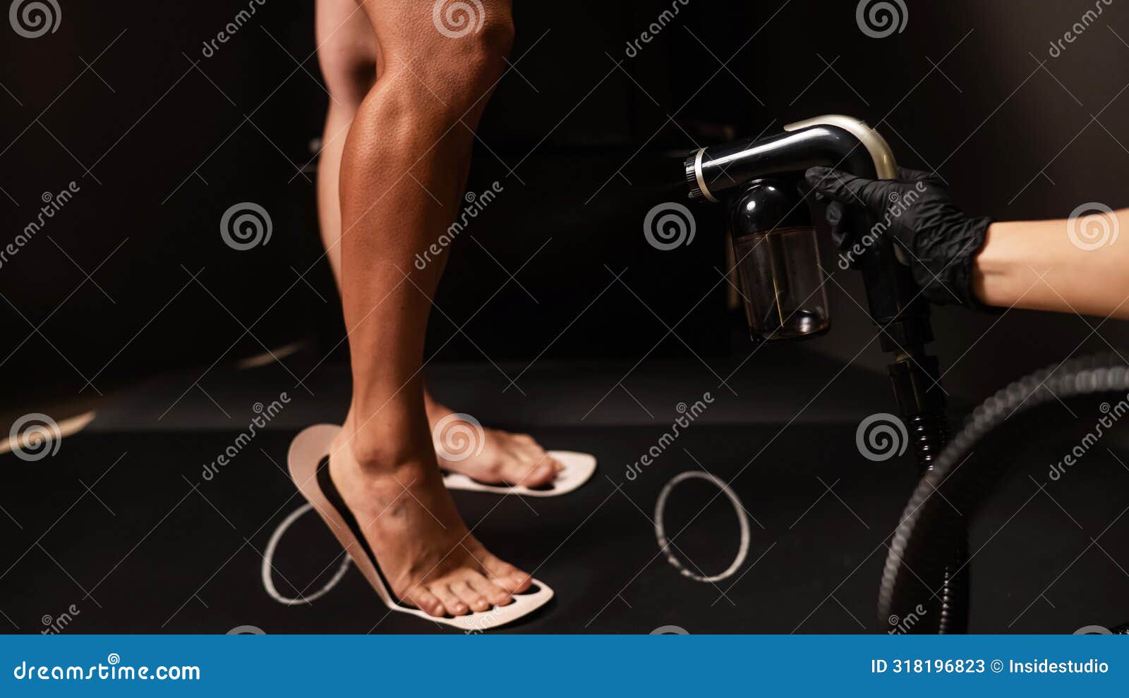 The Master Sprays Bronzer on the Clients Legs. Instant Tan. Stock Image ...