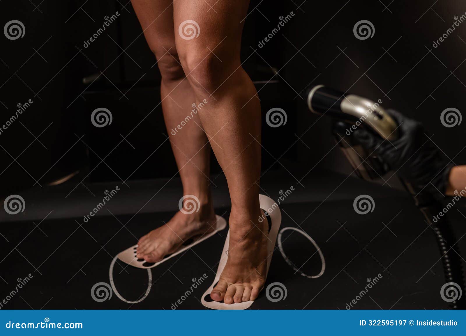 The Master Sprays Bronzer on the Clients Legs. Instant Tan. Stock Image ...