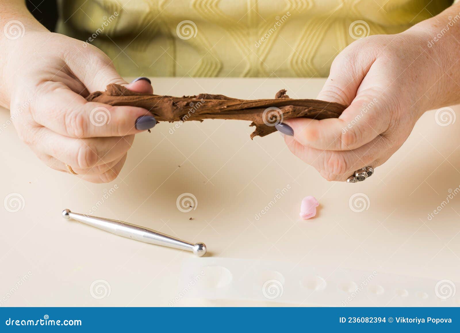 The Master Stretches Polymer Clay before Starting Modeling and Making ...