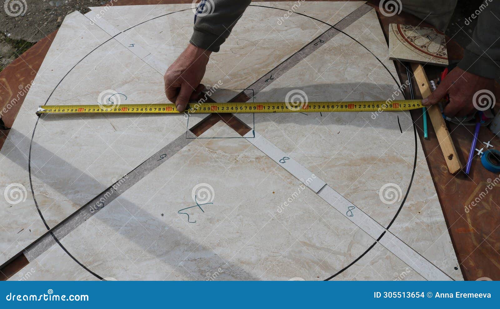 A Master Takes Measurements with a Ruler on the Top of a Homemade Table ...