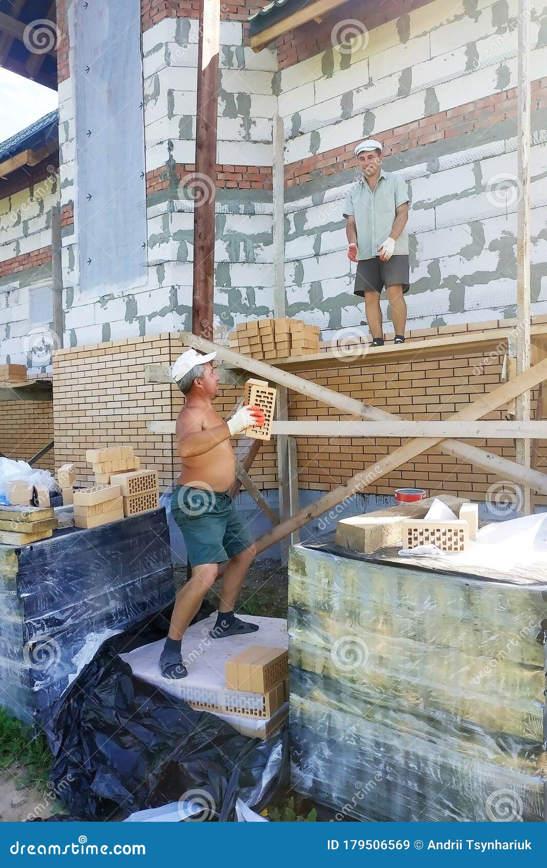 The Master Throws a Brick at His Worker for Laying the Wall Stock Image ...