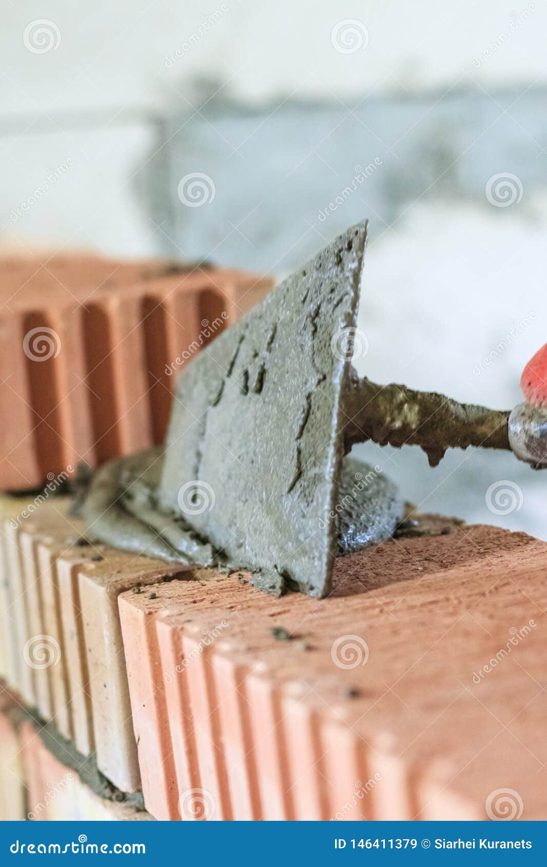Master with a Tool, Stacks a Red Brick. There is Illumination and ...