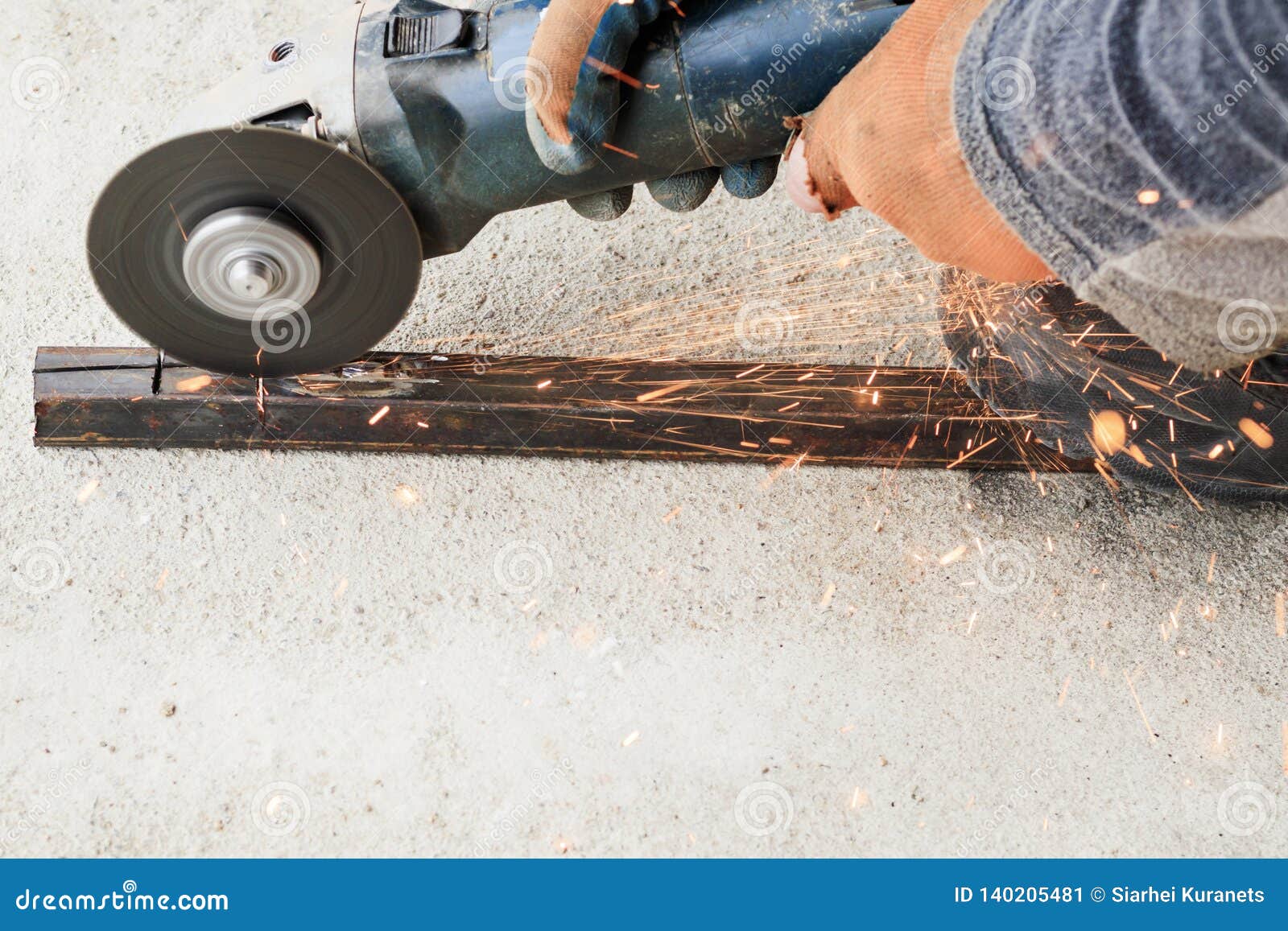 Master Using Grinders. a Lot of Sparks Burn and Work. Cuts a Square ...