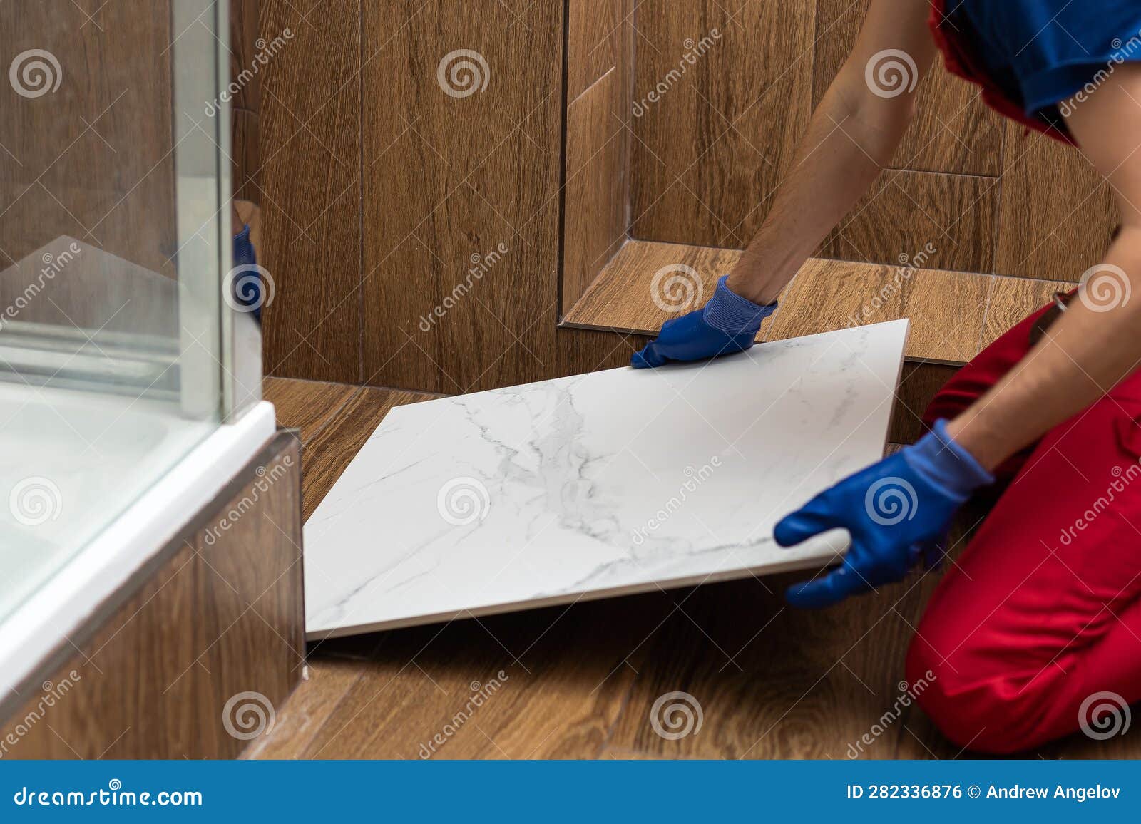 Master is Wearing Work Clothes, is Checking Horizon of Installing Tiles ...