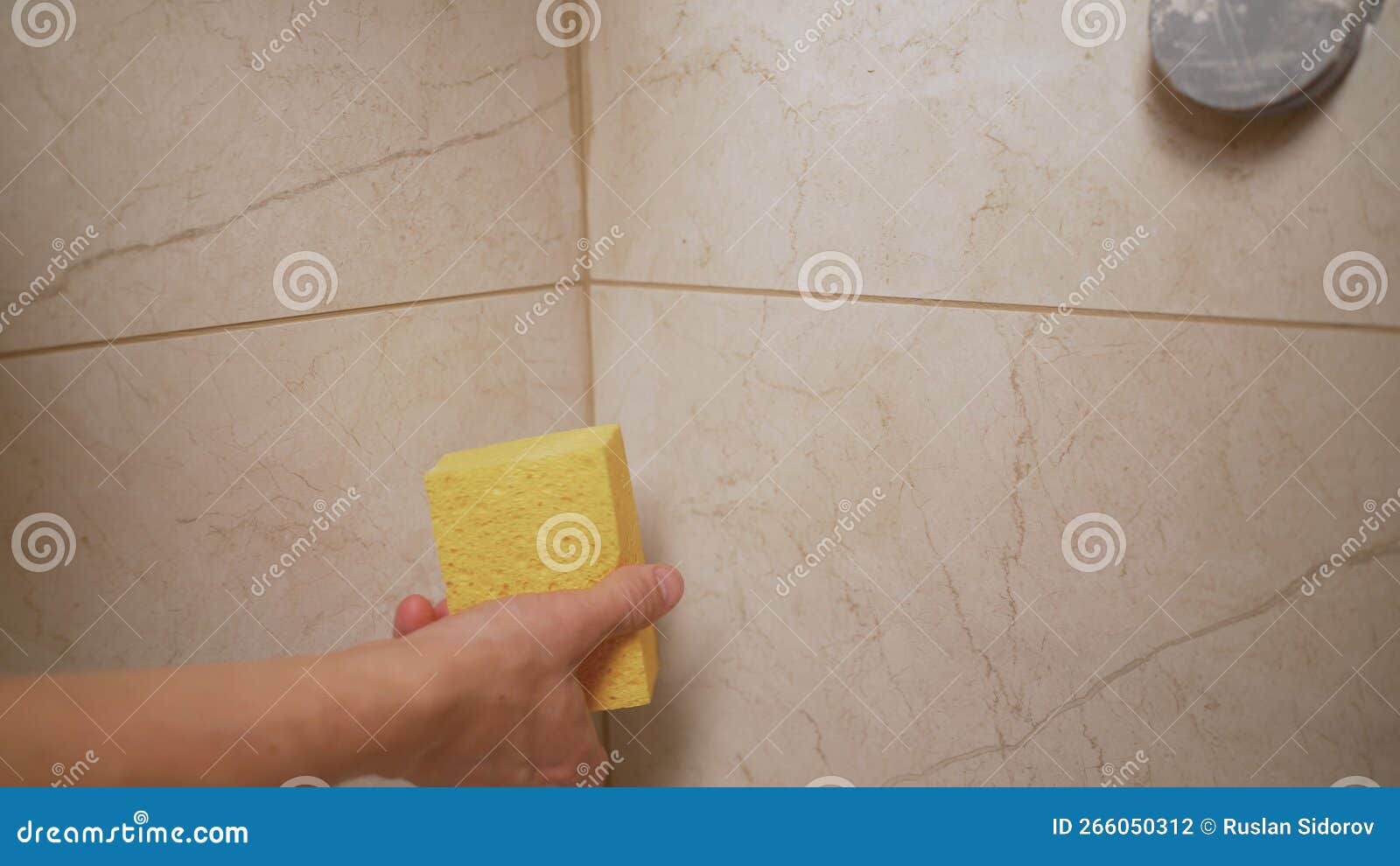 The Ceramic Tile Laying Master Wipes the Seams with a Special Sponge. the Master Wipes Ceramic ...