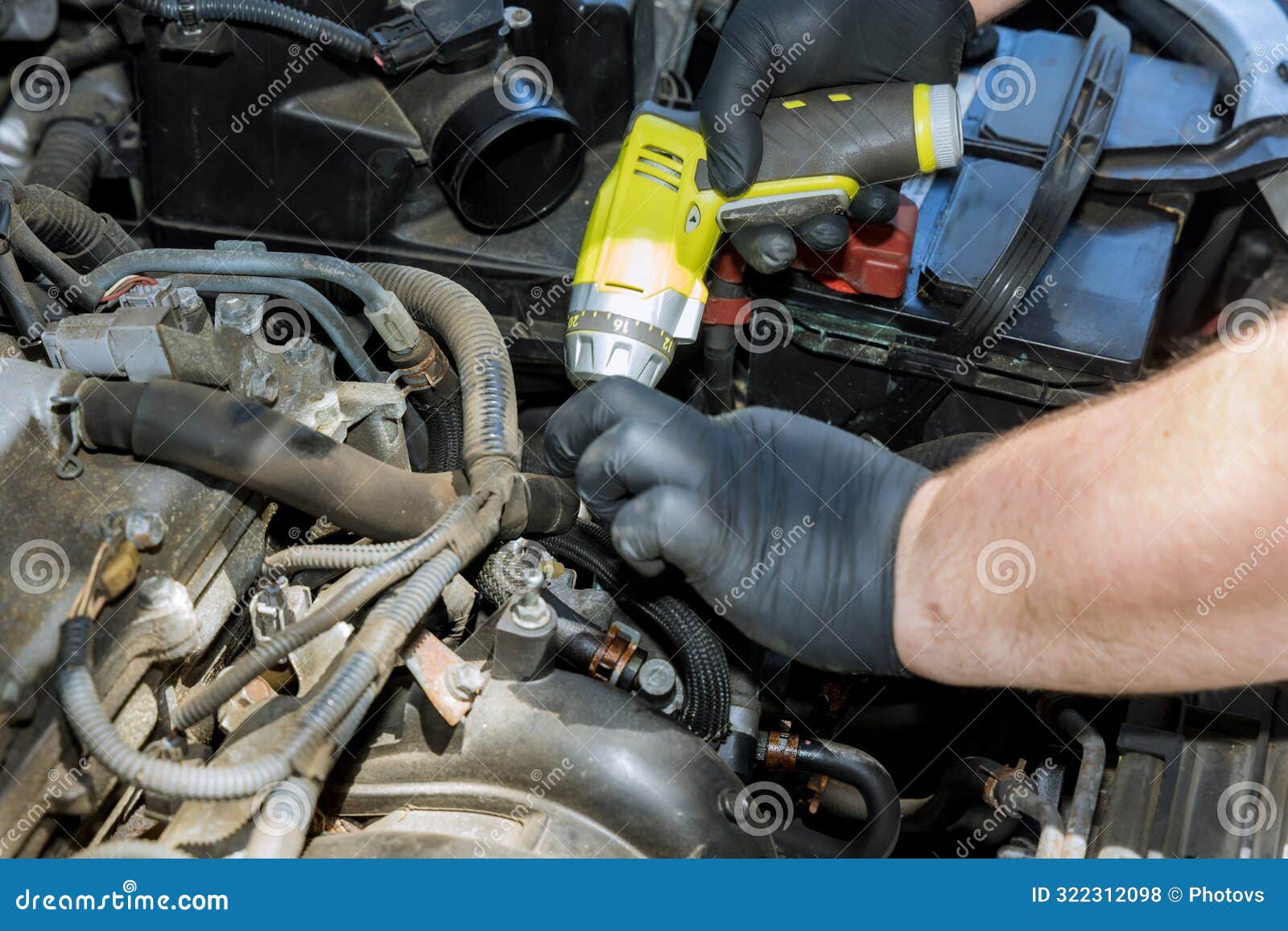 Master is Working on Service of an Engine Car in a Workshop Stock Photo ...