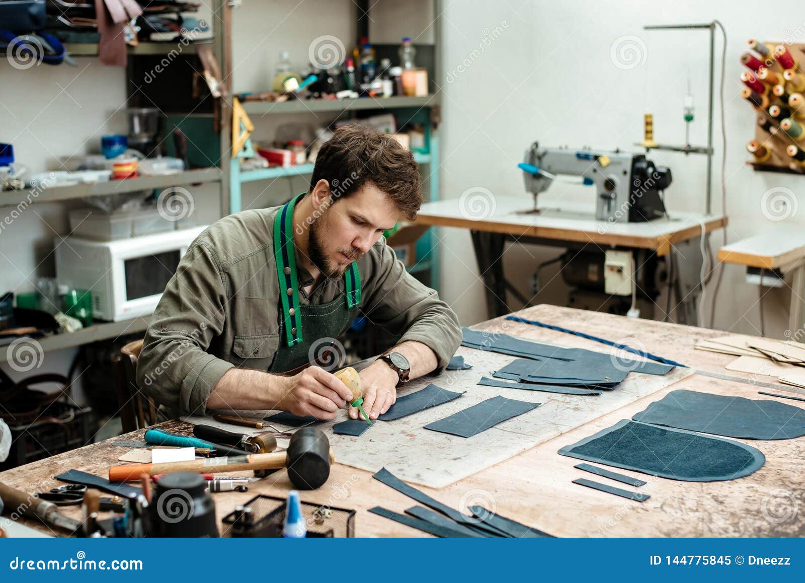 A Master Works with Genuine Leather in the Workshop Stock Image - Image ...