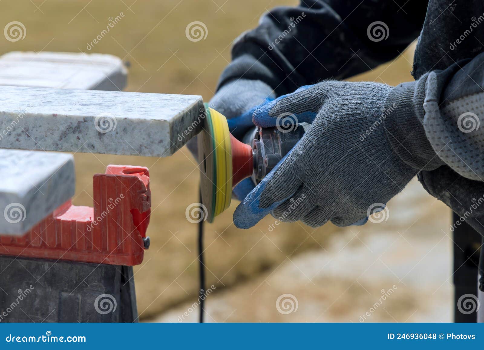 The Master Works with a Granite Stone Using a Grinder Stock Photo ...