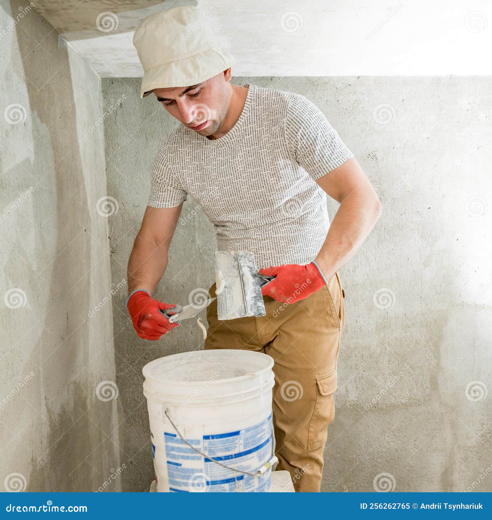 The Master Works with Lime Plaster, Leveling the Wall with a Spatula ...
