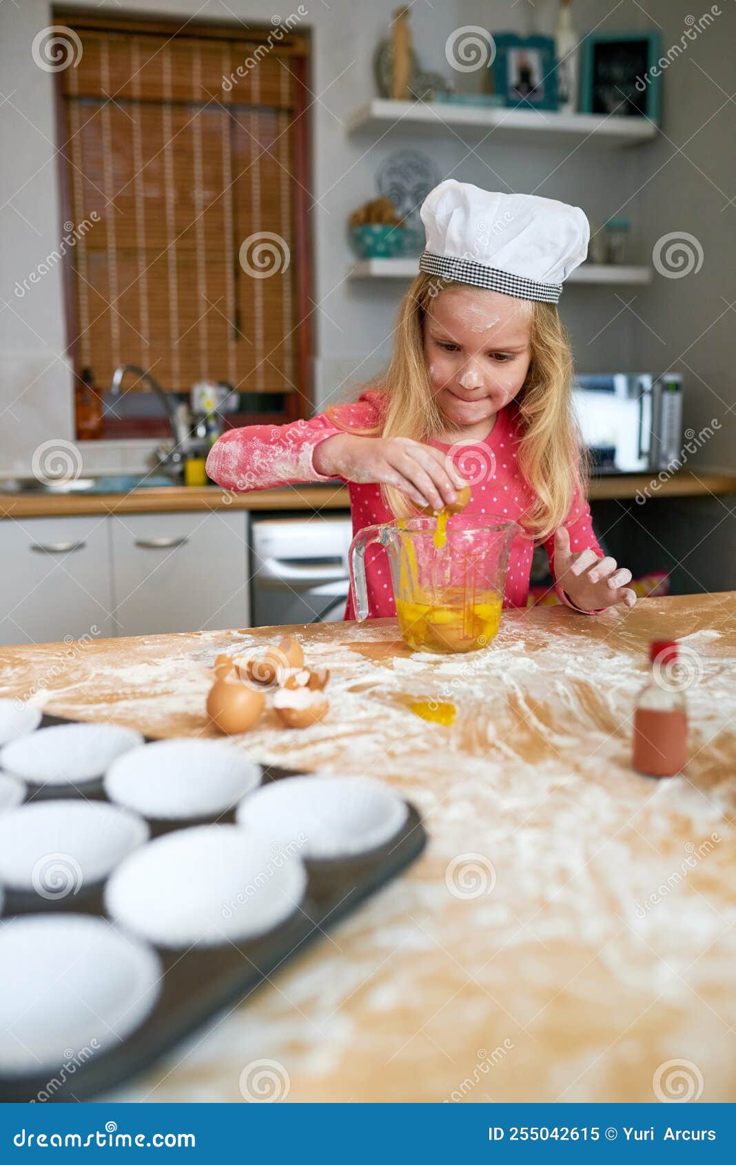 MAstering the Basics of Baking. a Little Girl Baking in the Kitchen ...