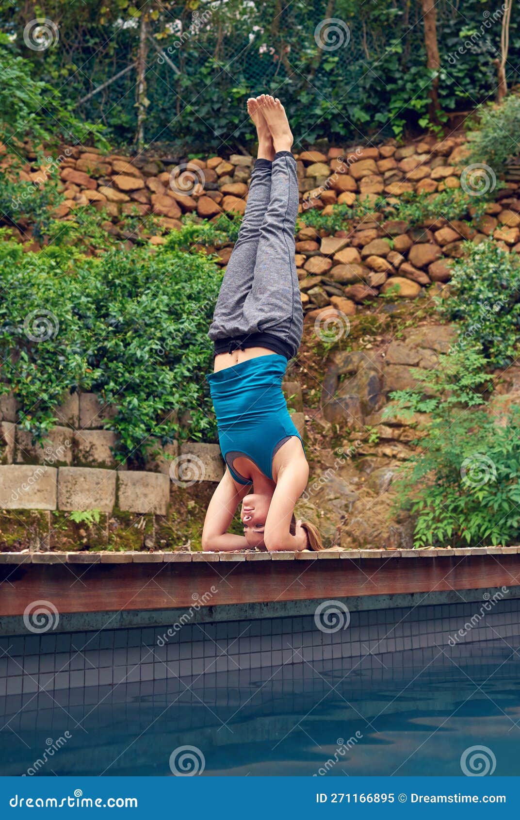 Mastering Her Mind and Body. a Young Woman Practicing Yoga Outdoors ...