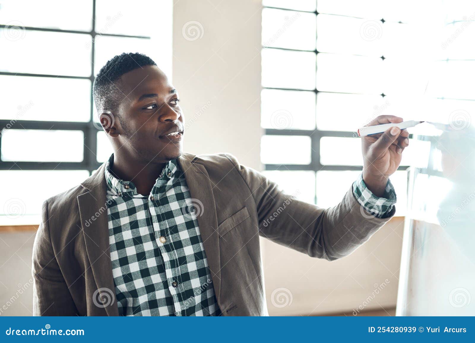 The Mastermind is at Work. a Businessman Using a Whiteboard during a ...