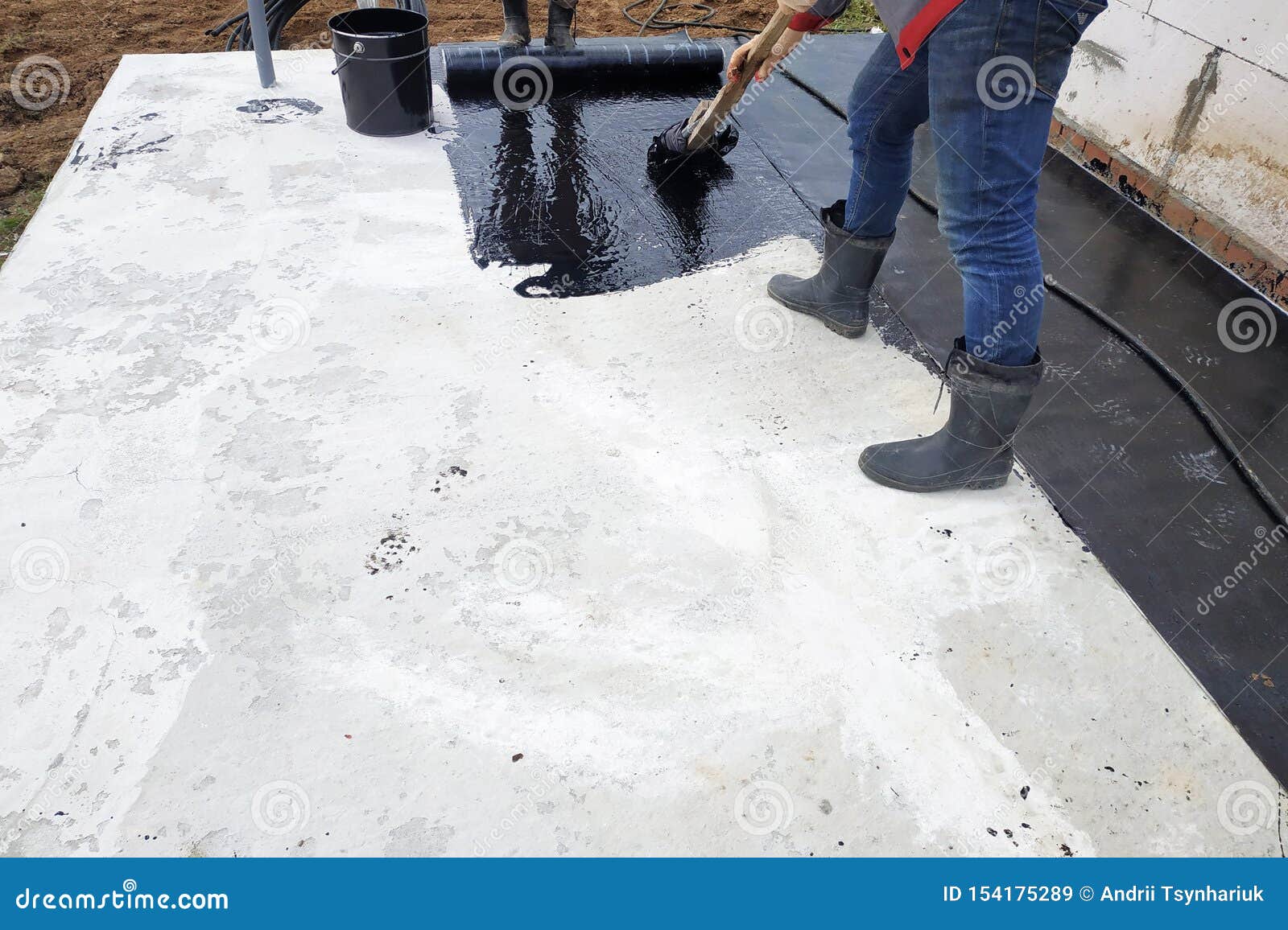 Masters Perform Work on the Waterproofing of Concrete in the Open Air ...