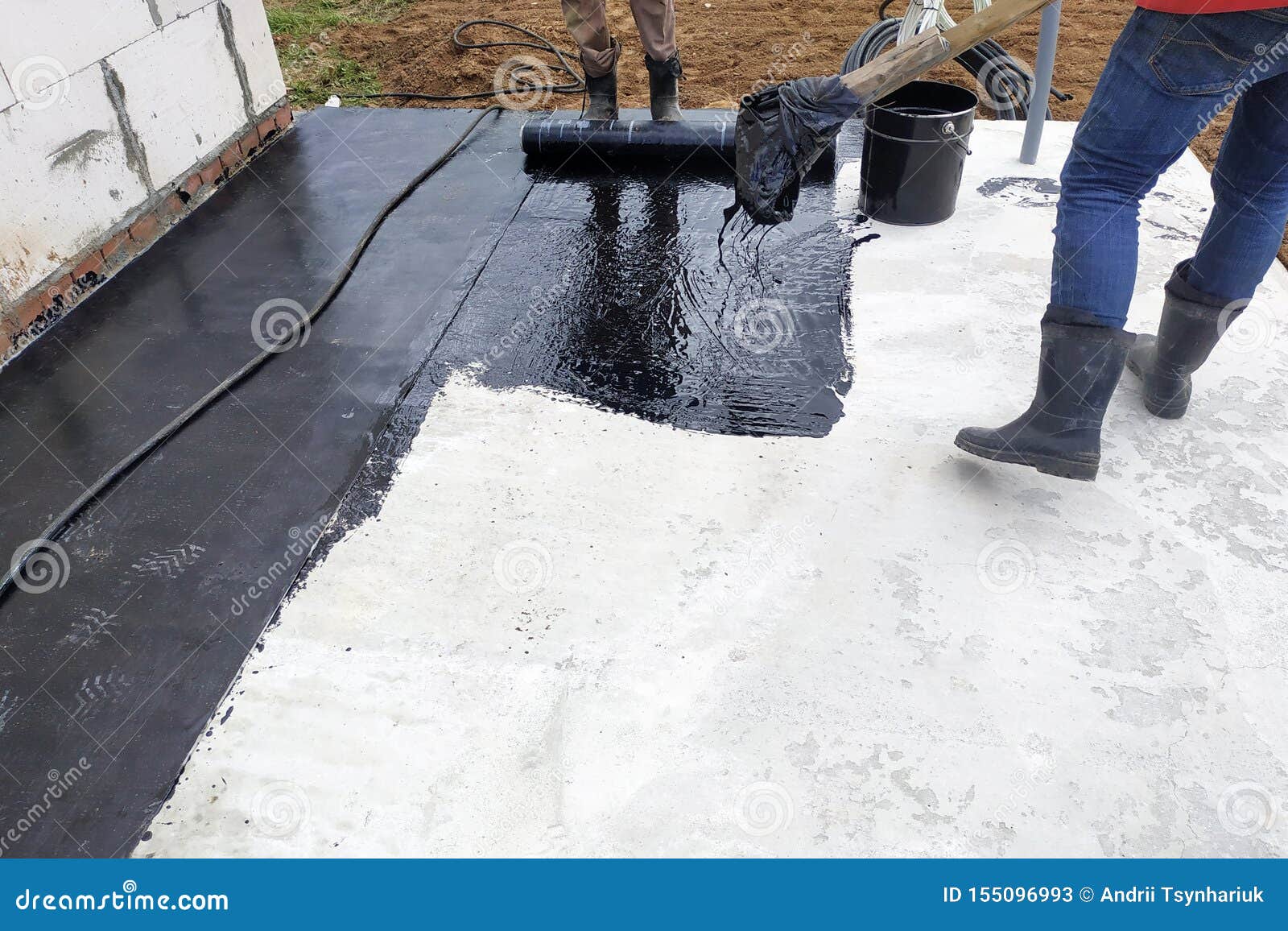 Masters Perform Work on the Waterproofing of Concrete in the Open Air ...