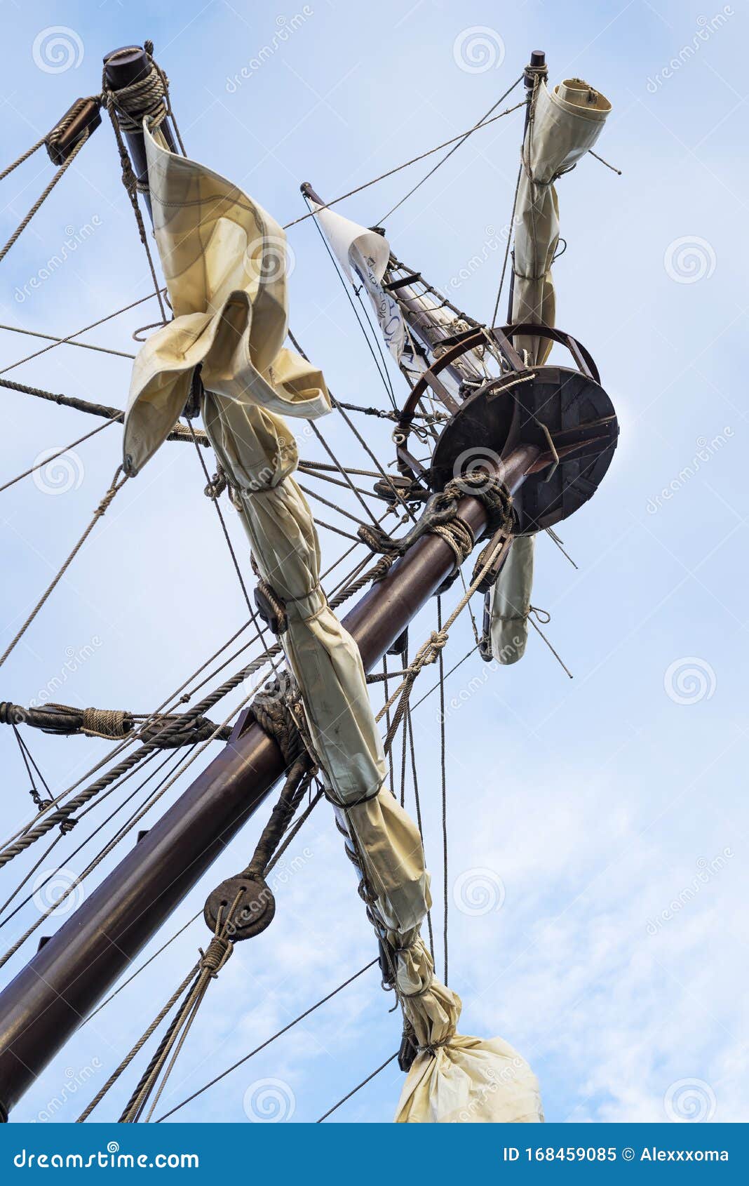 Masts and Rigging of Old Pirate Ship on Background of Cloudy Blue Sky ...