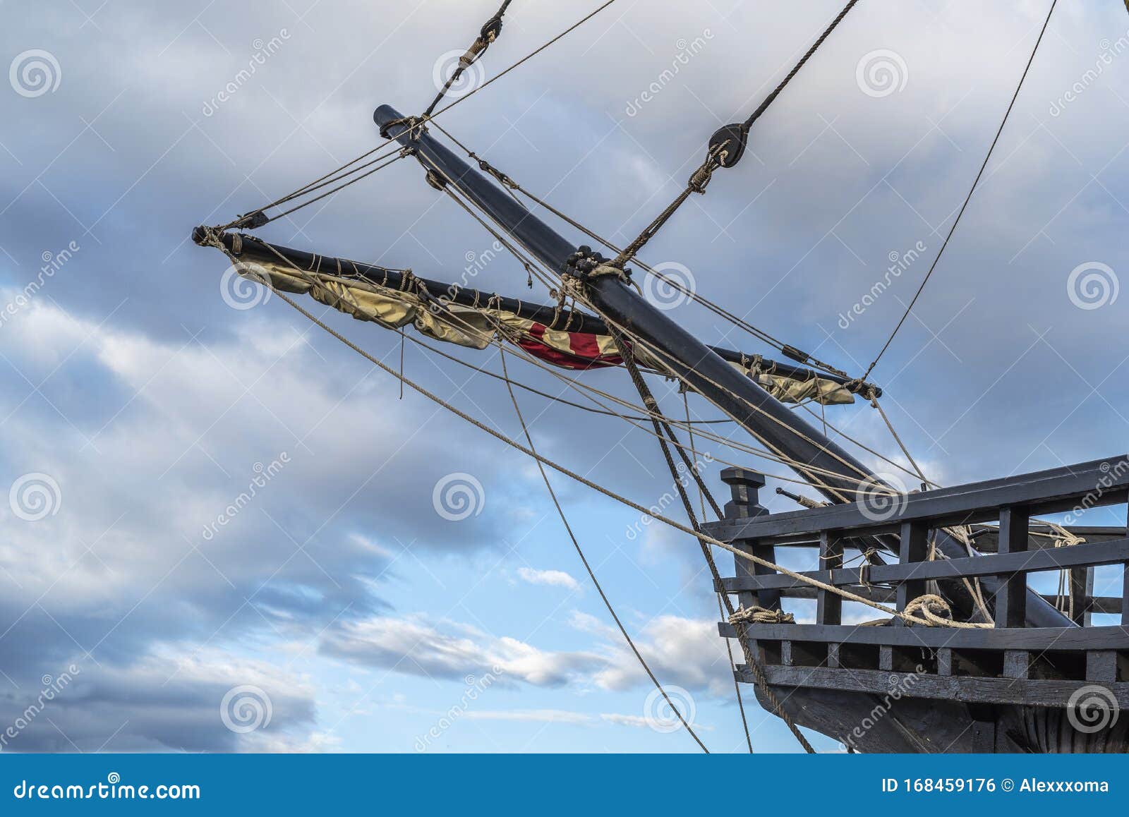 Masts and Rigging of Old Pirate Ship on Background of Cloudy Blue Sky ...
